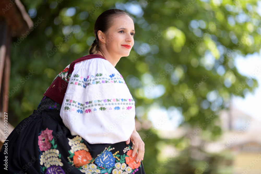 Young beautiful slovak woman in traditional costume. Slovak folklore ...