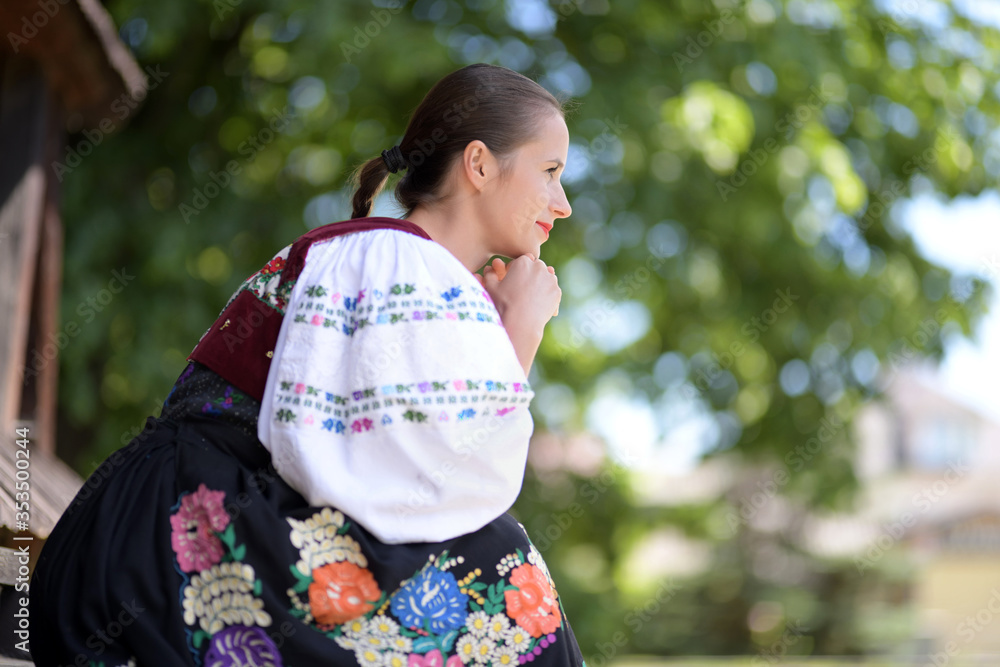 Young beautiful slovak woman in traditional costume. Slovak folklore ...