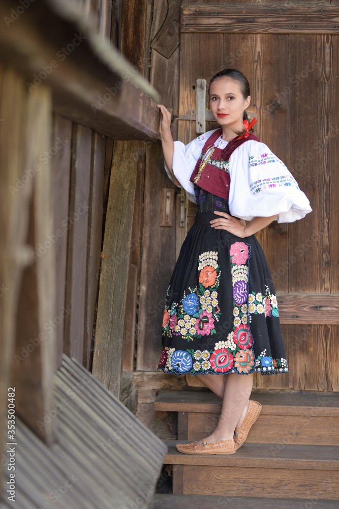 Young beautiful slovak woman in traditional costume. Slovak folklore ...