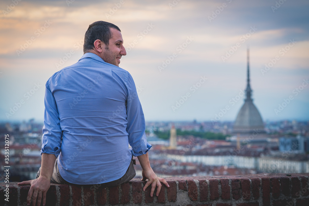 Man tourist enjoy panorama of Turin. Amazing scenic view on Mole ...