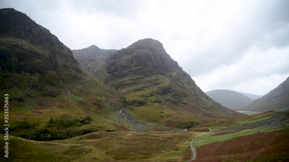 180-degree view of a large mountain range with hiking tracks and ...