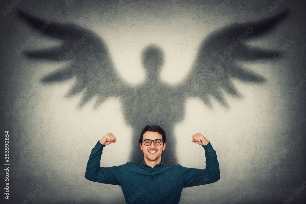 Confident businessman flexing muscles imagine superpower. Guy shows his ...