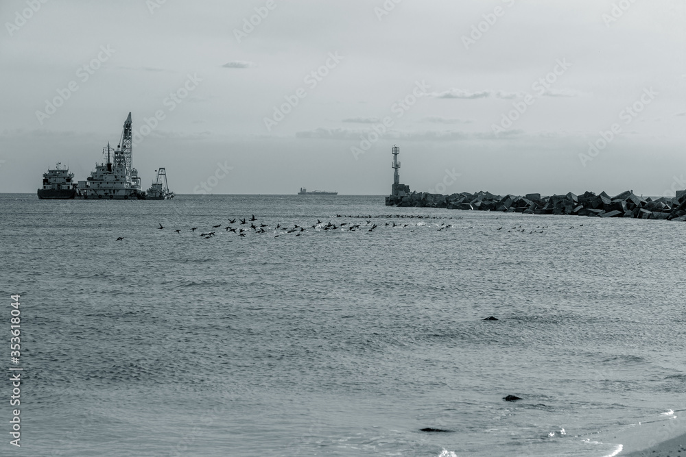 seascape with an excavator. Deepening maritime expedition for cargo ...