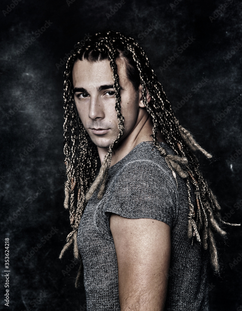 Attractive blonde male model with combination of braids and dreadlocks ...
