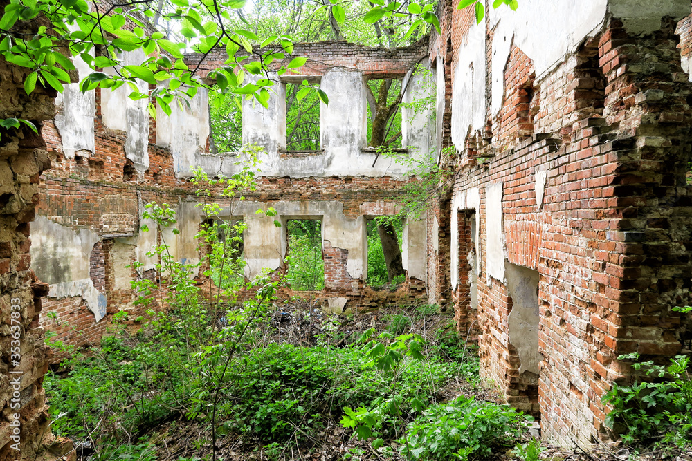 Brick walls of an ancient ruined house. The old facade of a ruined ...