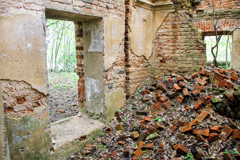 Brick walls of an ancient ruined house. The old facade of a ruined ...