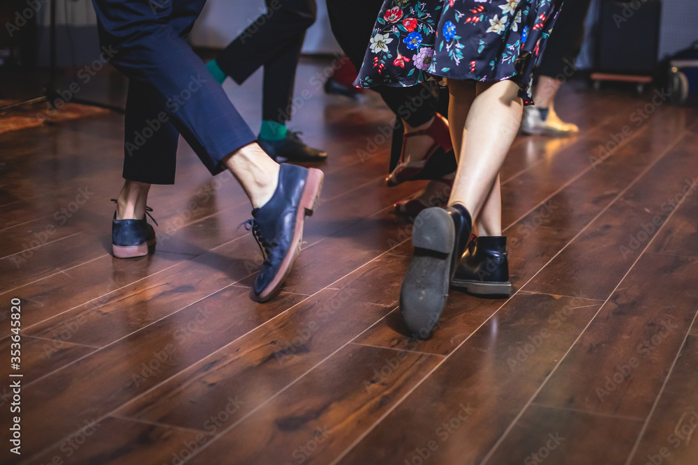 Dancing shoes of young couple dance retro jazz swing dances on a ...