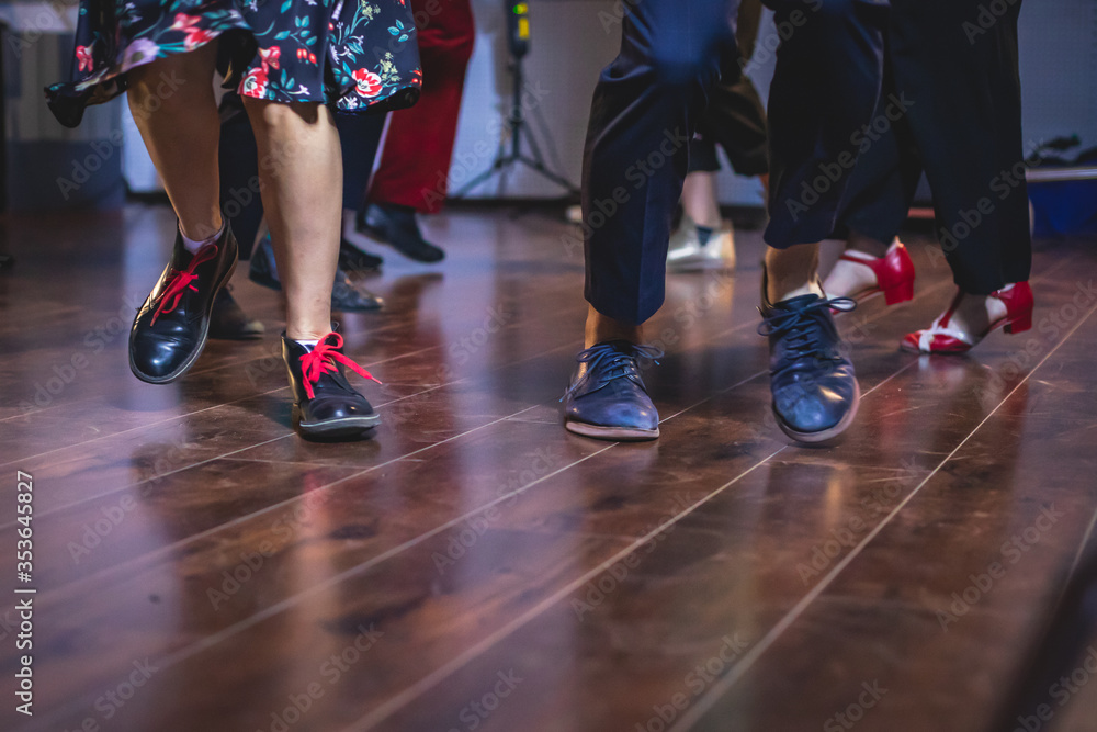 Dancing shoes of young couple dance retro jazz swing dances on a ...