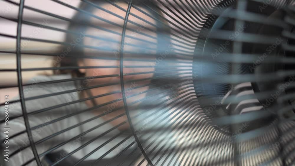 4K Woman face in the background behind ventilator Stock Video | Adobe Stock