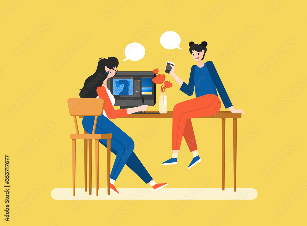 Women are sitting at a computer in a modern office and talk. Girl ...