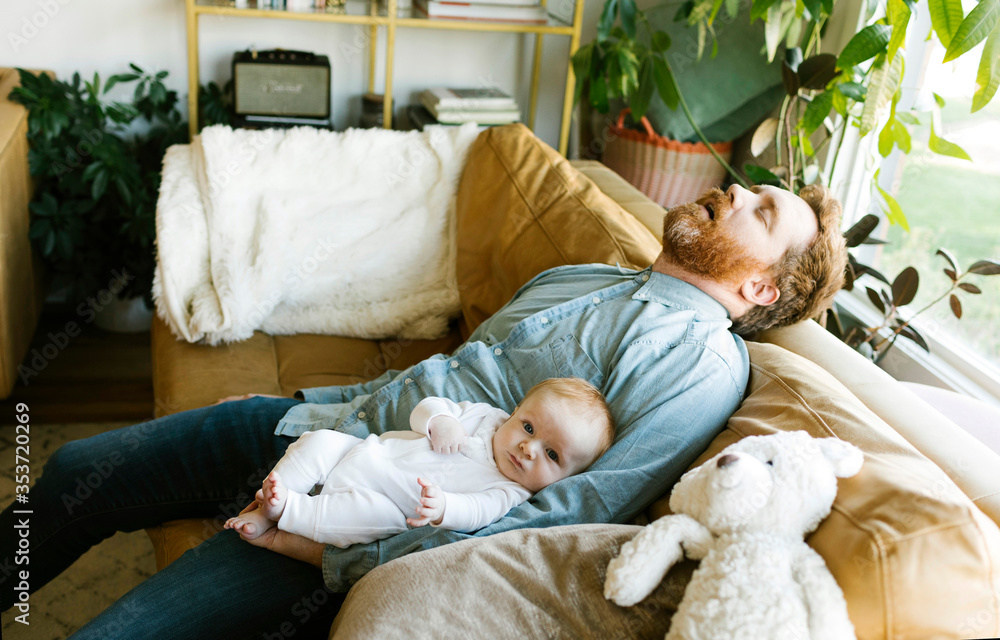 Sleeping father with baby son (2-3 months) on sofa Stock Photo | Adobe ...