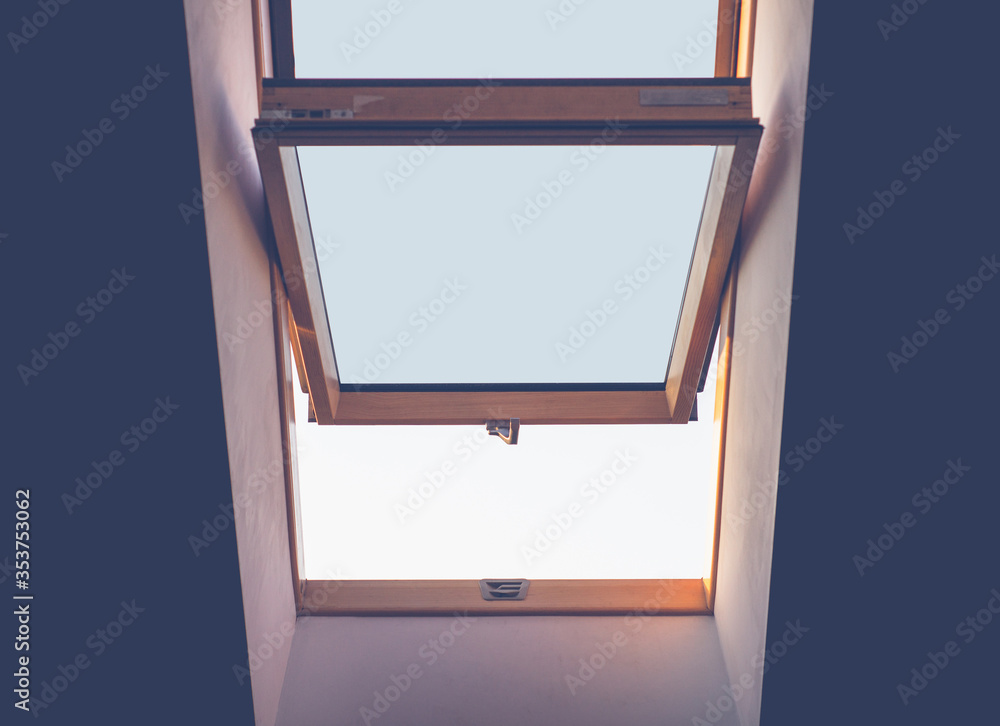 the window in the middle in the ceiling of the room is ajar Stock Photo ...