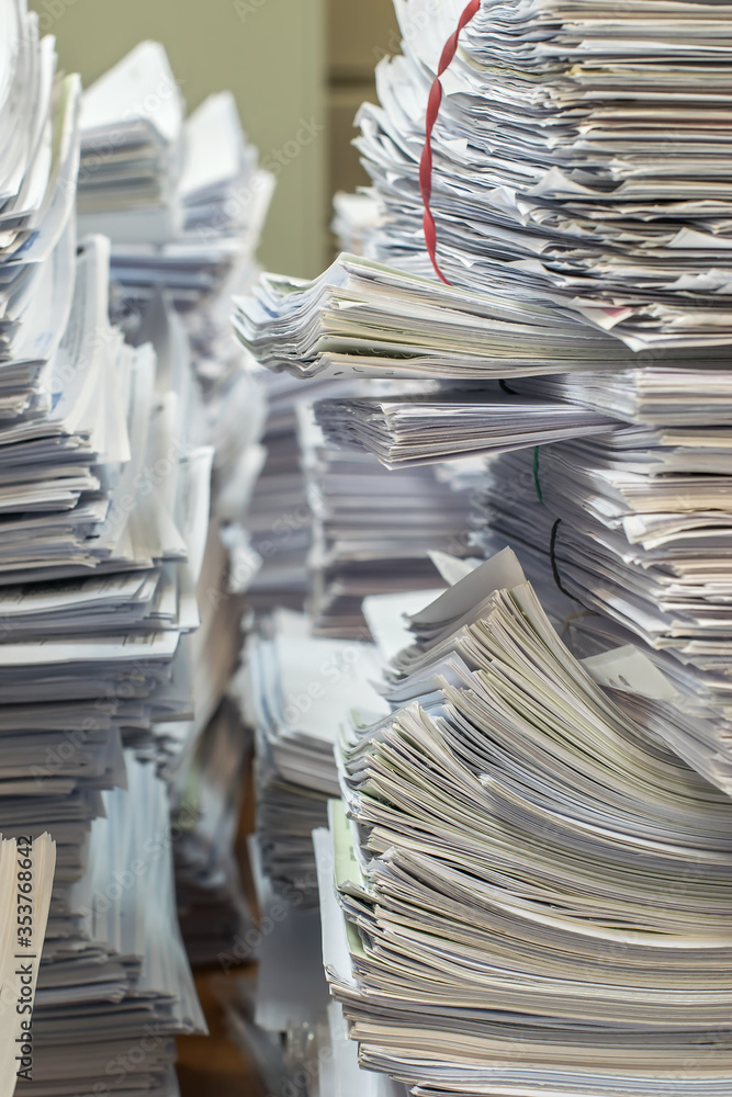 bundles bales of paper documents. stacks packs pile on the desk in the ...
