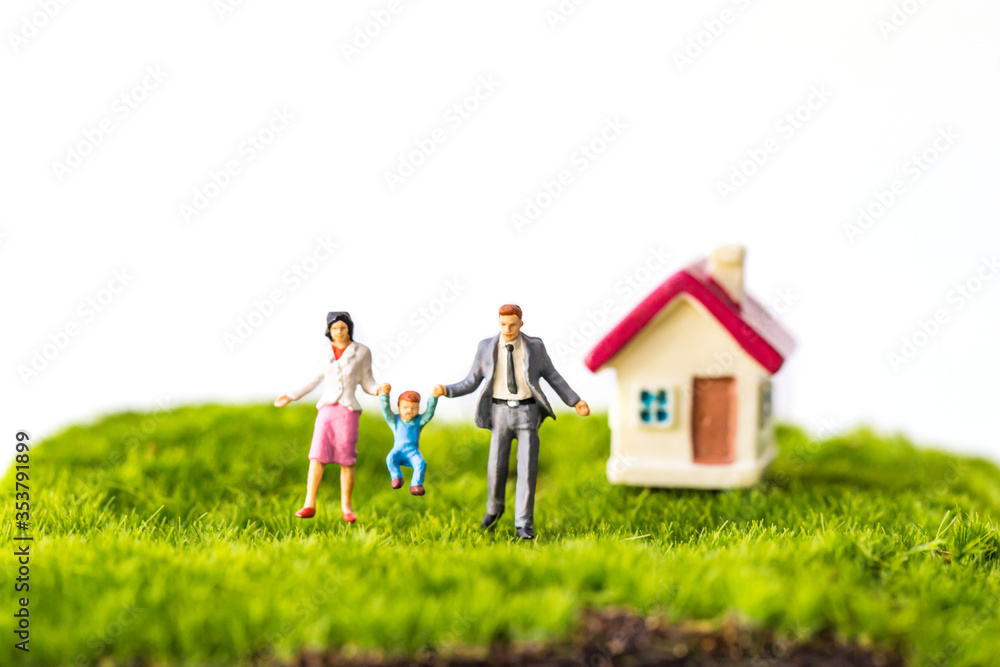 miniature family with father,mother ,son and miniature house with red ...