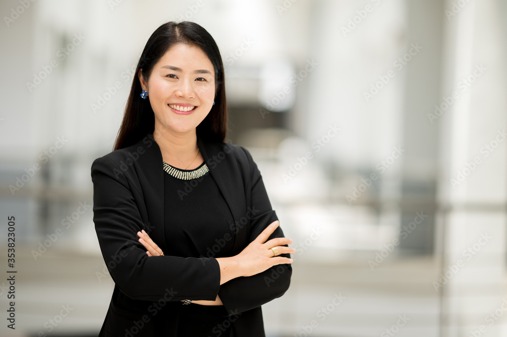 portrait Working woman Asian wearing a black suit, smiling, Crossed ...