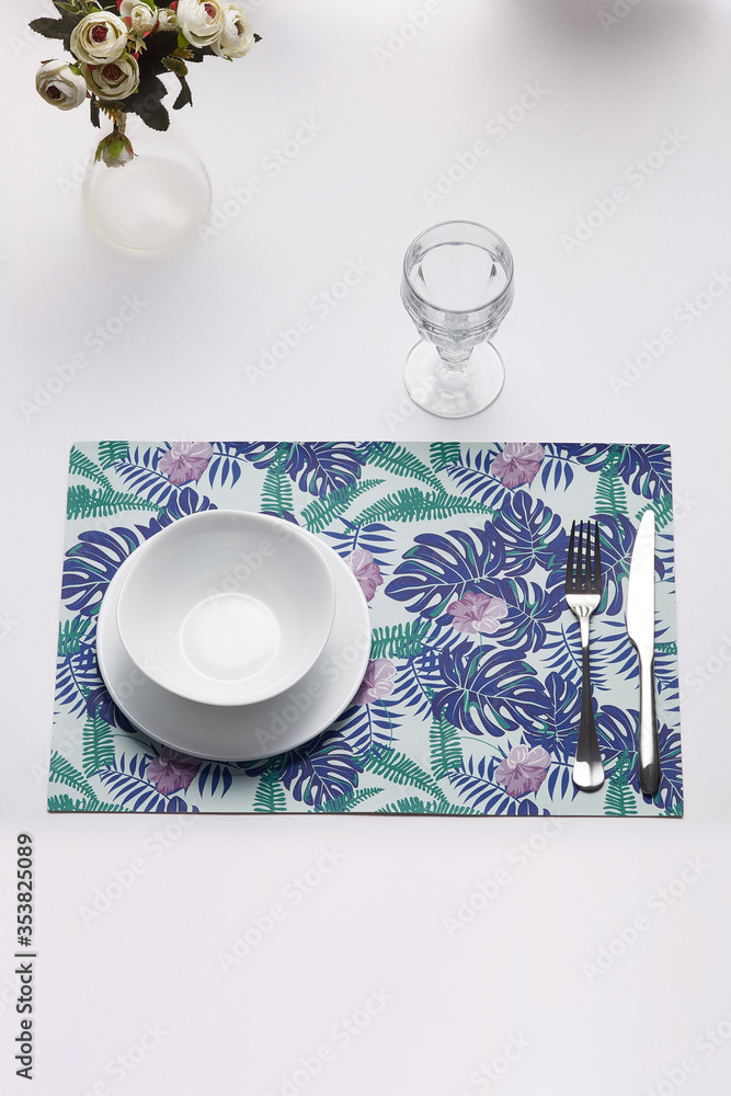 Subject photo of setting table. Plates, a fork and a knife are located ...