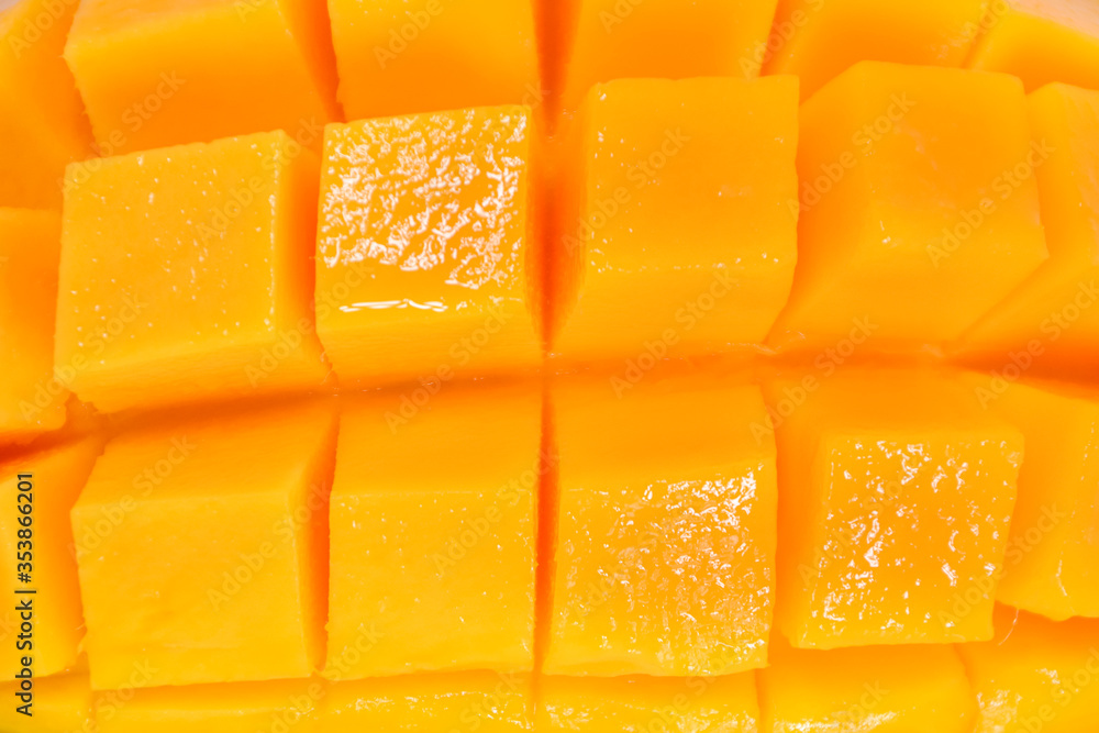 Overhead background texture of colorful orange tropical mango in full ...