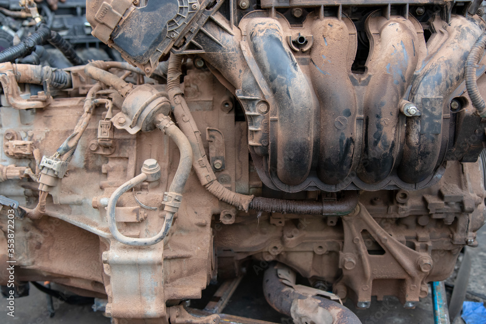 Parts of car's engine, car's engine in fixed process, rusty metal ...
