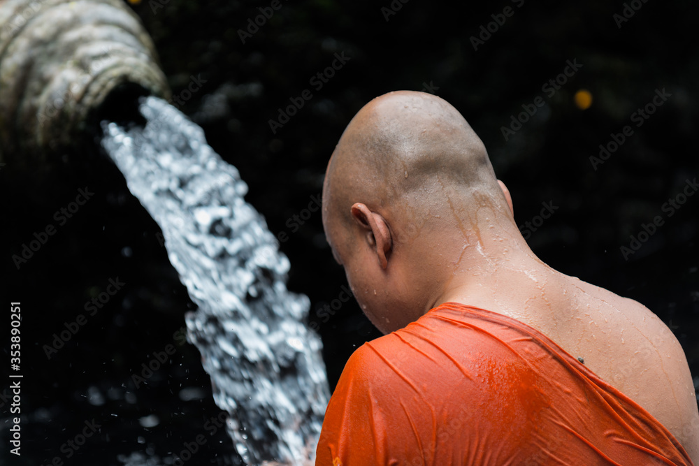 Devotee praying at holy spring water temple Pura Tirtha Empul during ...