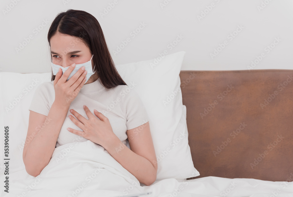 Asian women wearing medical masks that are sick, coughing, use their ...