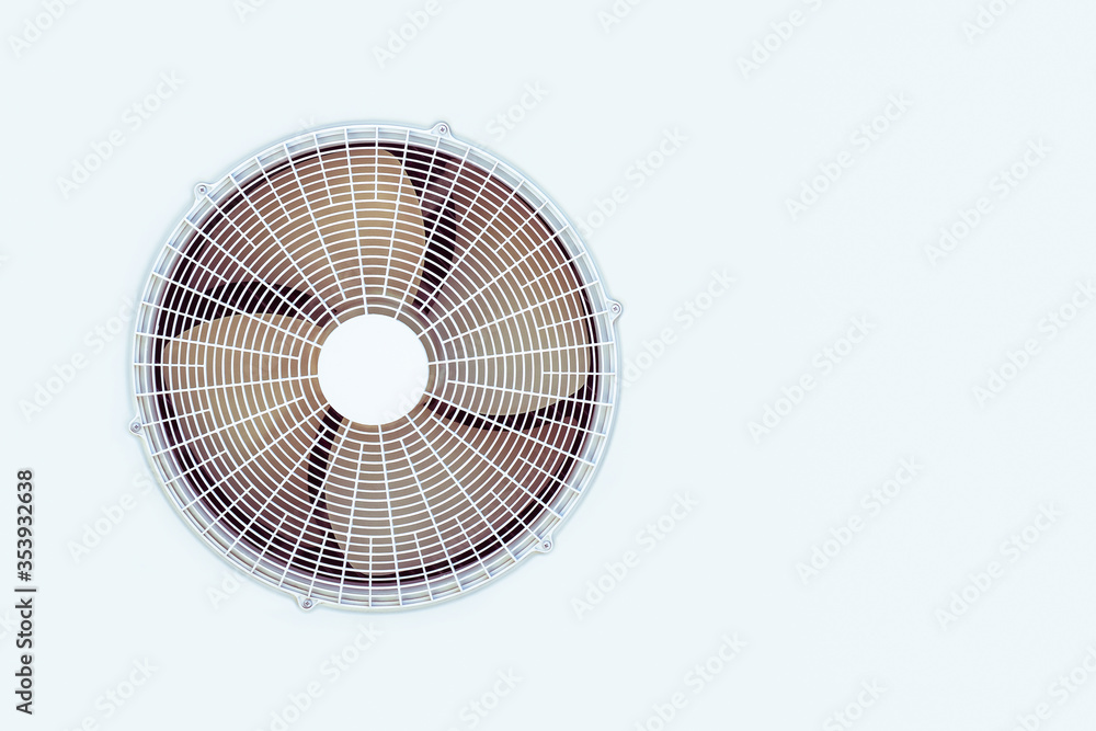 Condenser unit coil fan of an air conditioner. White outer air ...