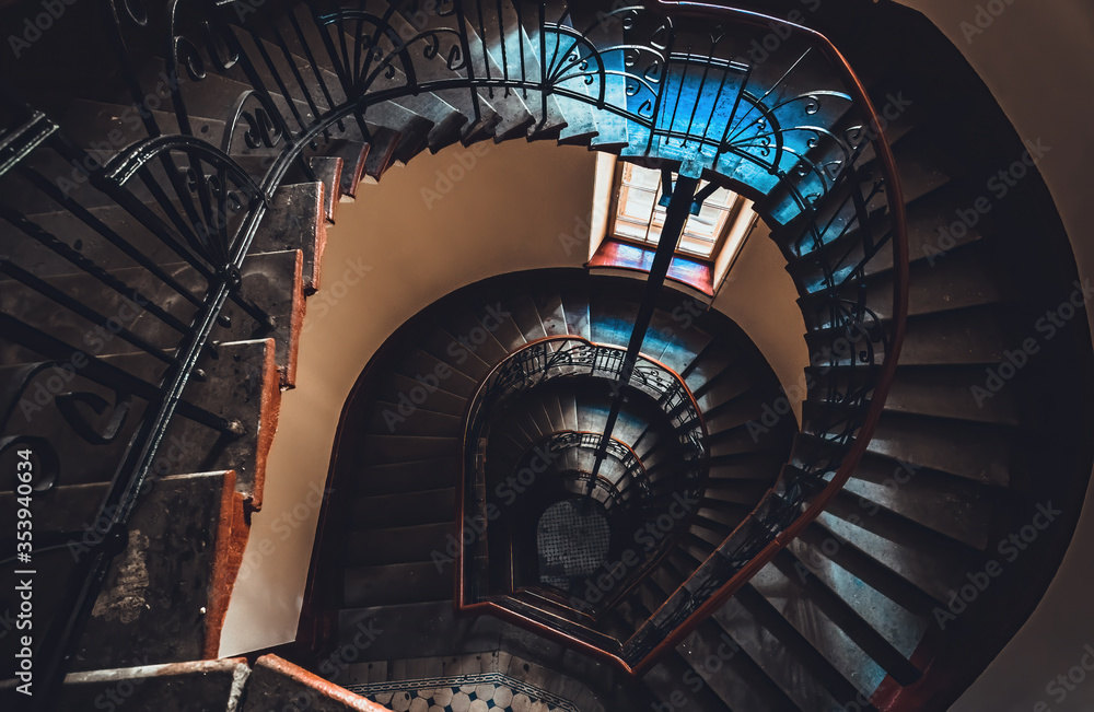 Destroyed spiral staircase indoors. Natural light. Beautiful ...
