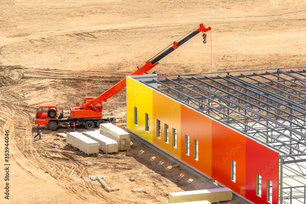 Construction site covered by sand with installed building frame ...
