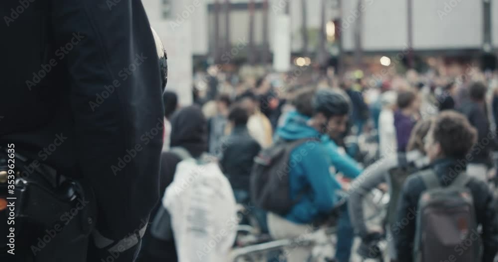 Police officer in protection riot gear helmet gun and baton stick ...