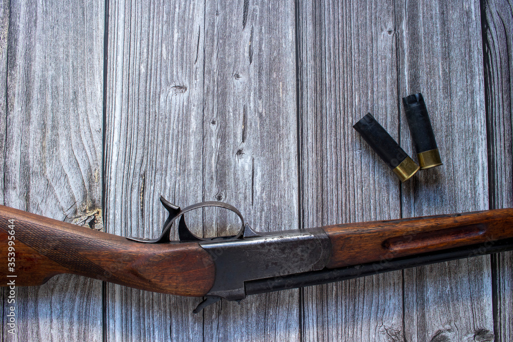 Old hunting rifles and ammunition on a dark background with a top view ...