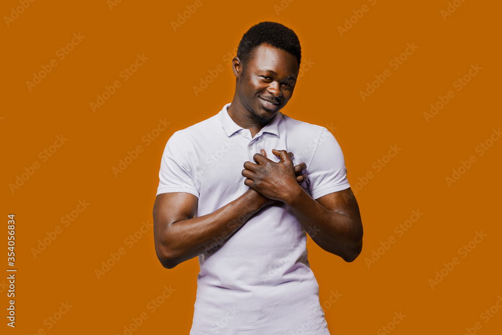 Relaxed black man closes eyes and hugs themselves. Calm and ...