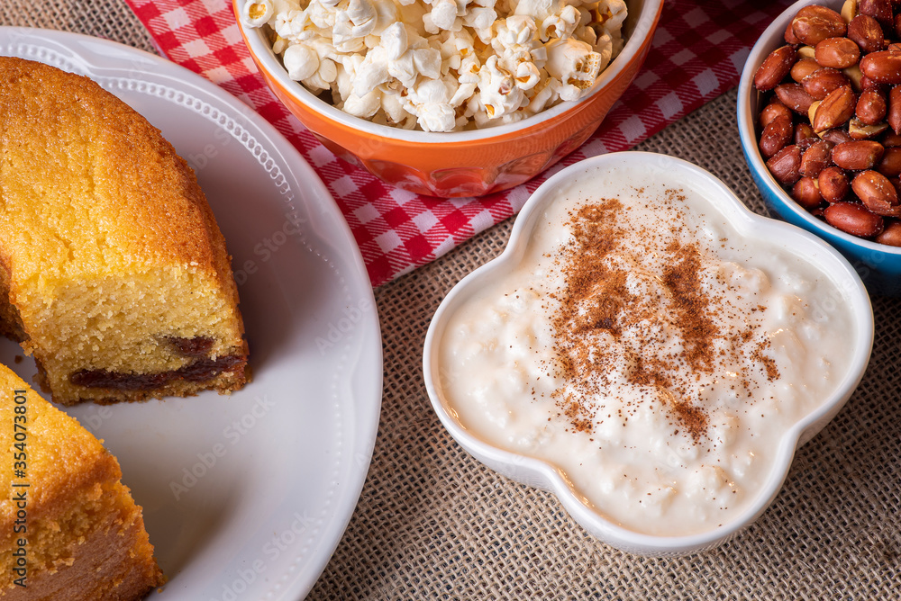 June party. Typical sweets from festa junina. Cornmeal cake, popcorn ...
