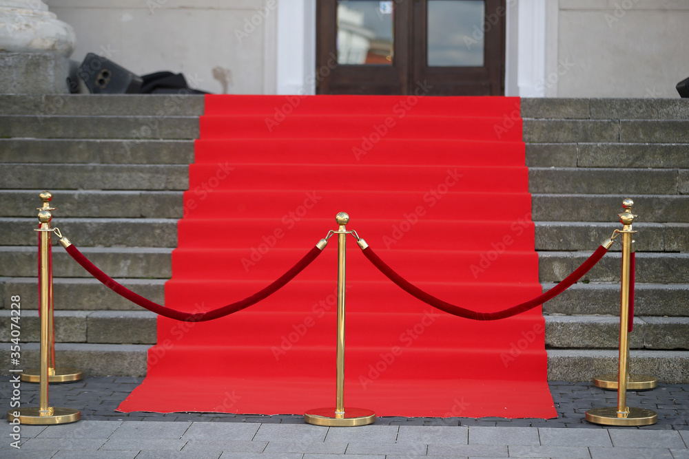 Elegant long red carpet on the wide steps of historic building Stock ...
