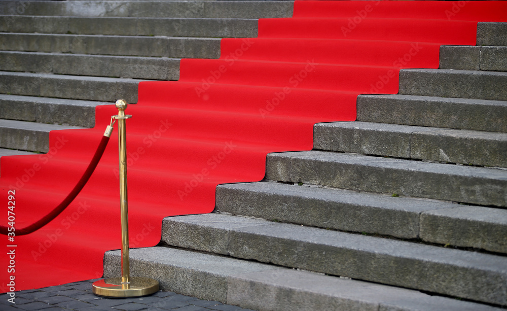 Elegant long red carpet on the wide steps of historic building Stock ...