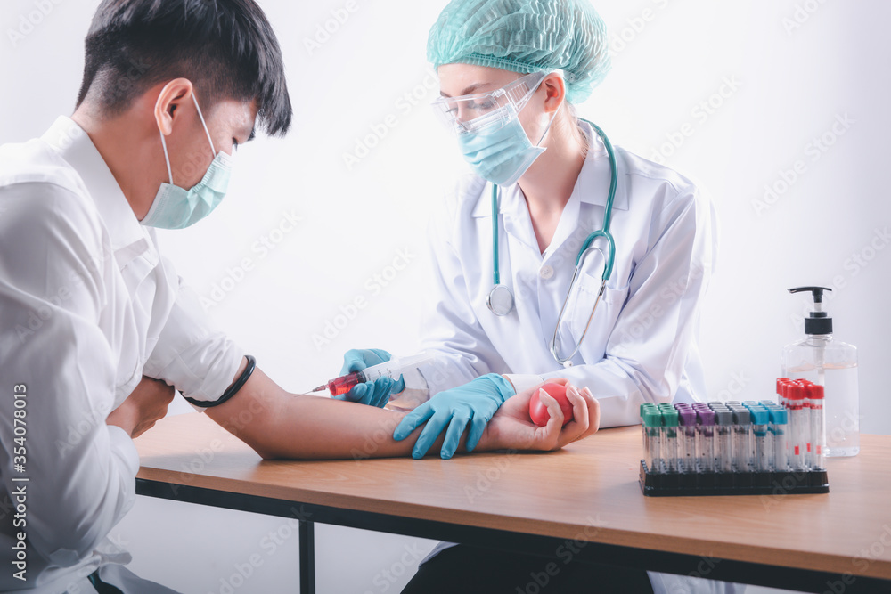 Medical Doctor is Collecting Blood Sample Test Syringe Injection From ...