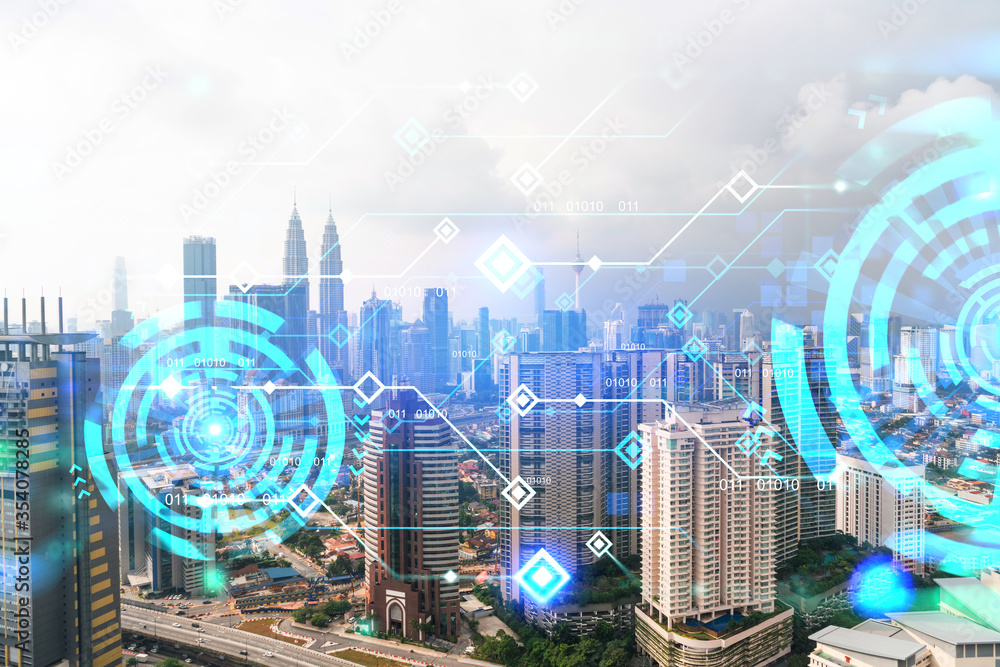 Technology hologram over panorama city view of Kuala Lumpur. KL is the ...