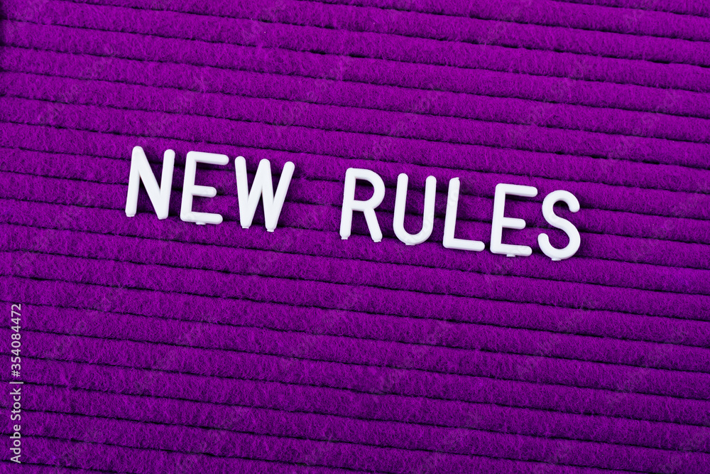 Foto de New rules text on purple and blue background letter board ...