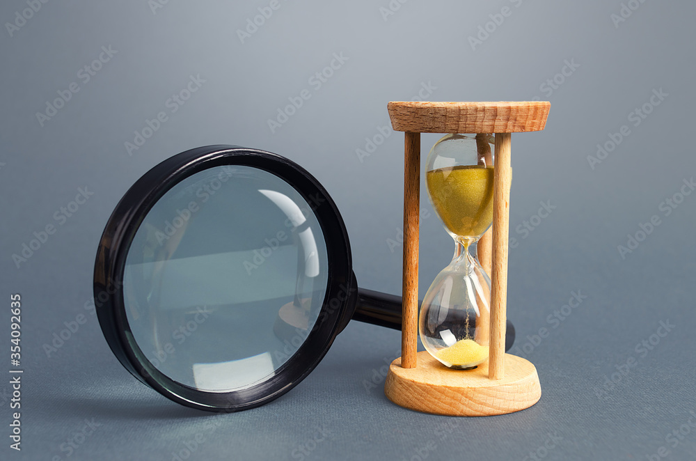 Magnifying glass and hourglass. Limited Search Concept. Find free time ...