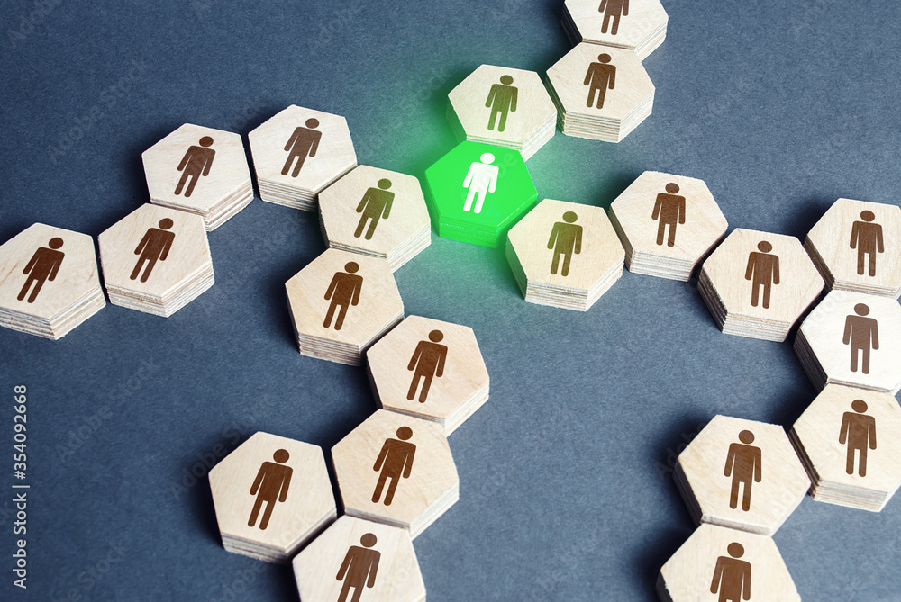 Green human figure is a connecting element of a network of people. A ...