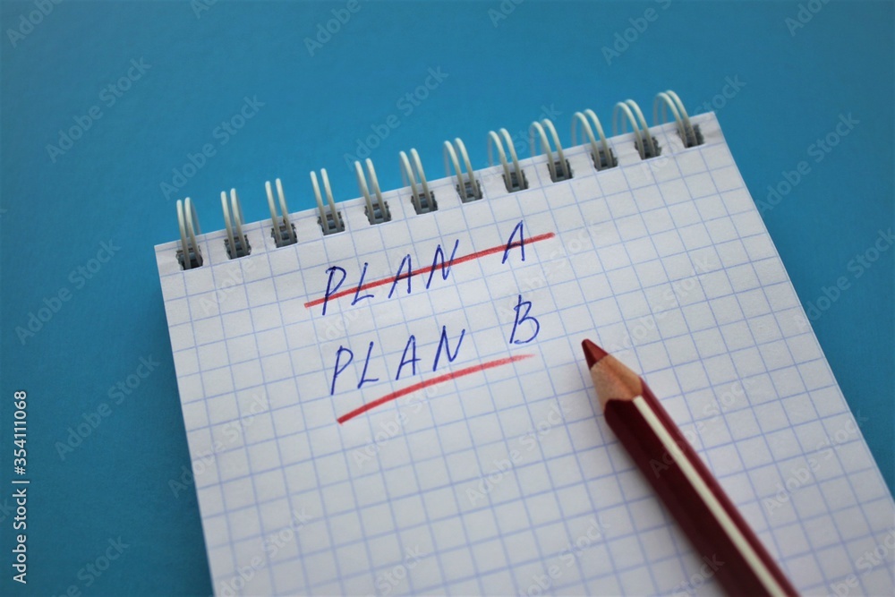 In a spiral notebook in a cell crossed out with a red pencil Plan A ...