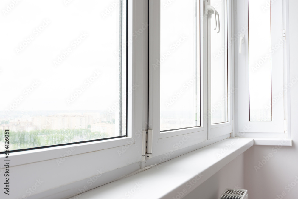 Plastic window sill on a balcony glazed with plastic windows Stock ...