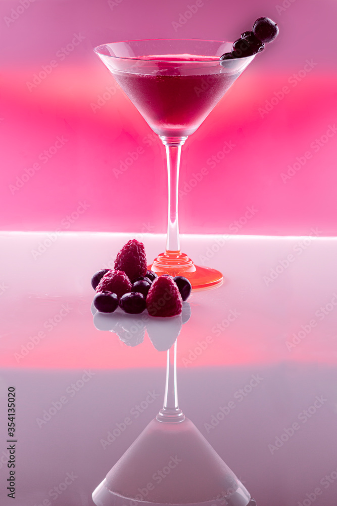 Cosmopolitan cocktail glass with color effect and fruit Stock Photo ...