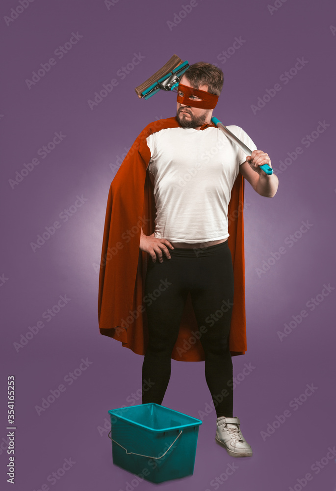 Super hero cleaner professional. Confidence man in red superhero ...