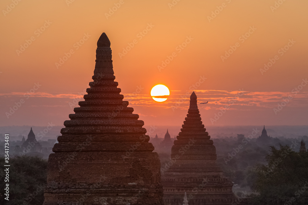 Sunrise over ancient pagodas in Bagan (Pagan), Myanmar, with a ...