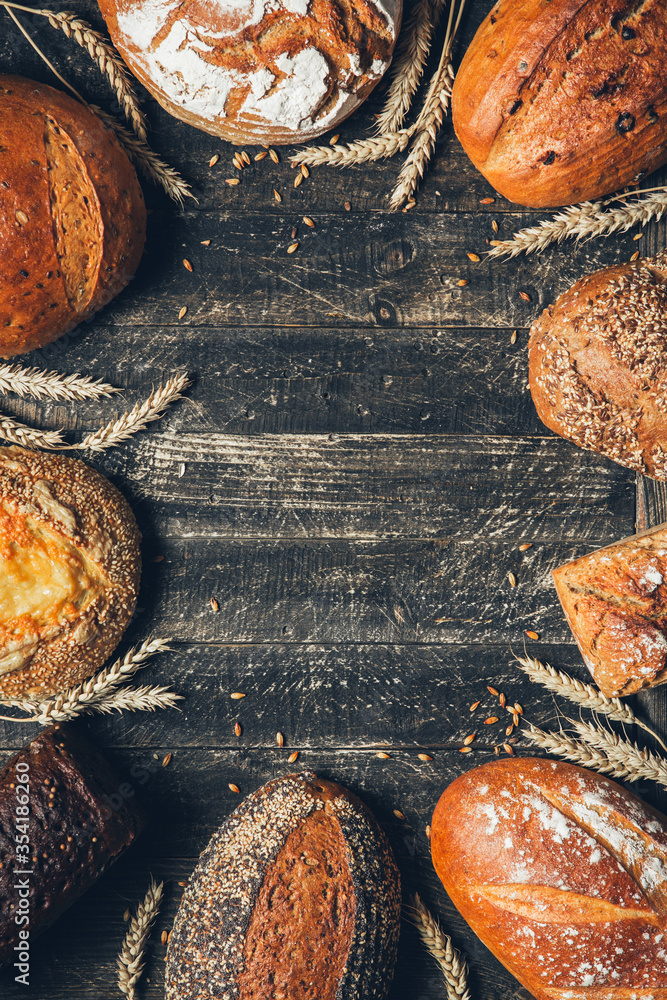 Bread border on wood background with copy space. Whole grain loaves ...