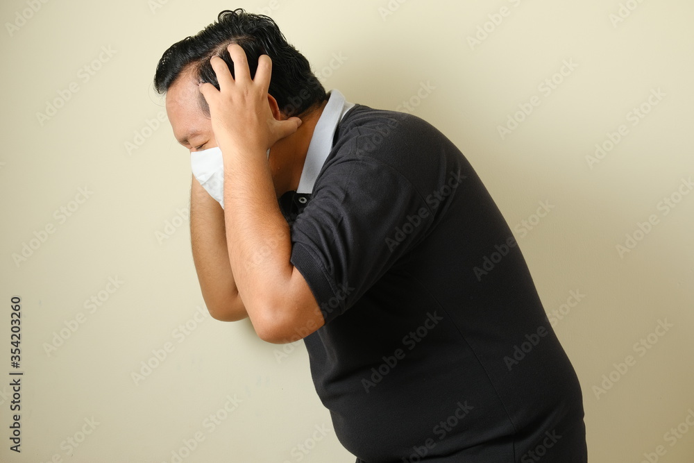 Fat Asian guy wearing a mask Stock Photo | Adobe Stock
