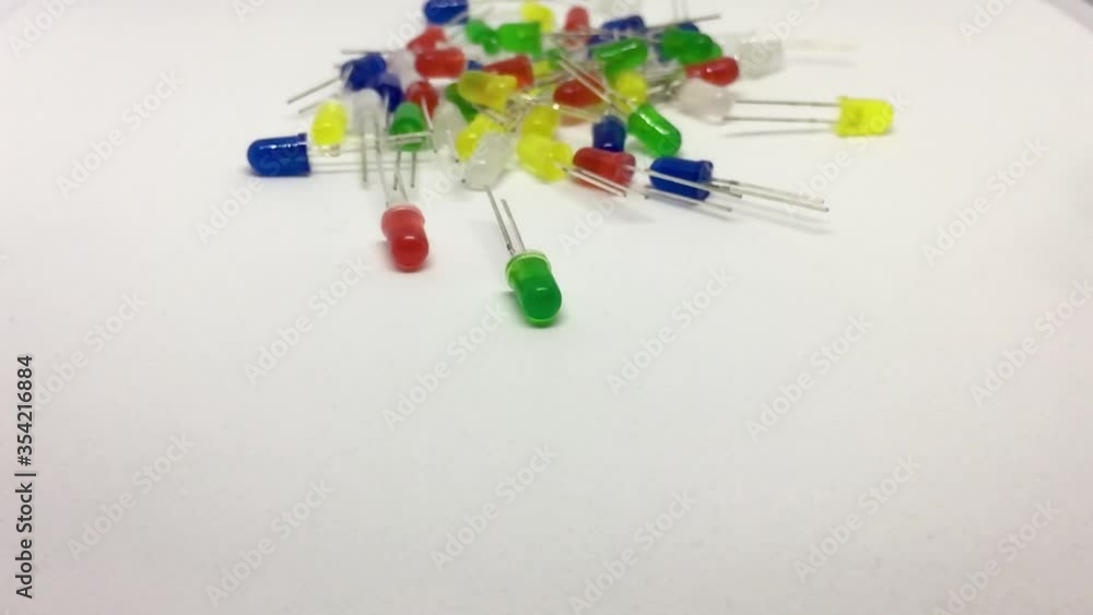 Pan Back from stack of LEDs. Light-emitting diode (LED) in blue, yellow ...