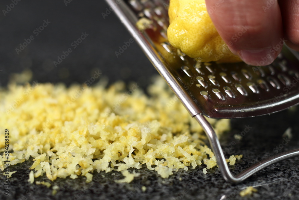 Grating lemon. Making Shoofly Tart Series. Stock Photo | Adobe Stock