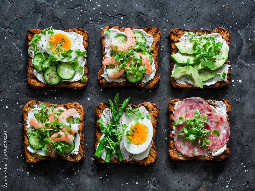 Variety breakfast, appetizer, tapas sandwiches with cream cheese, egg ...