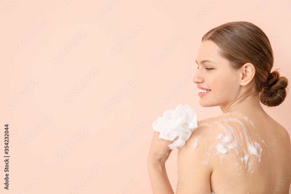 Beautiful young woman taking shower on color background Stock Photo ...