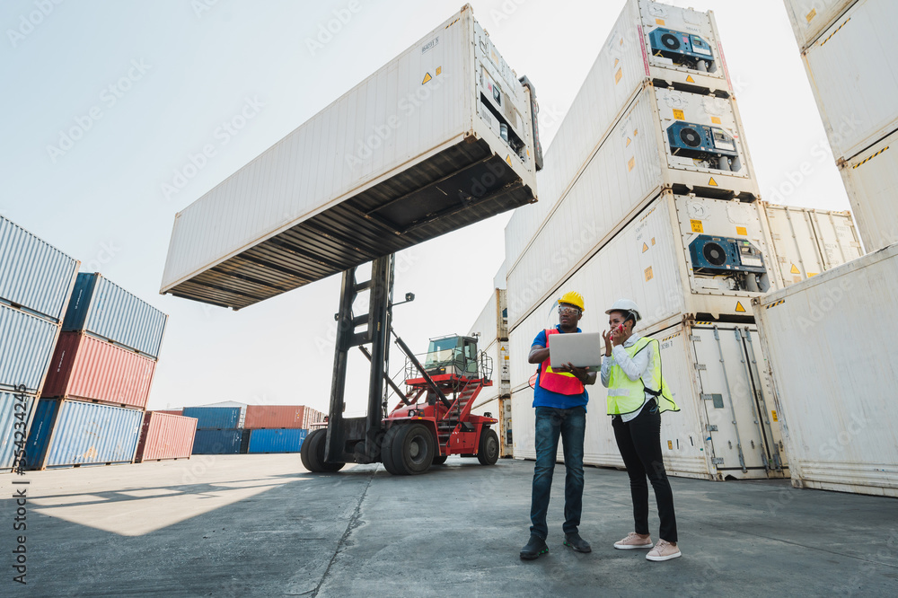 Two Black foreman man & woman worker working checking at Container ...